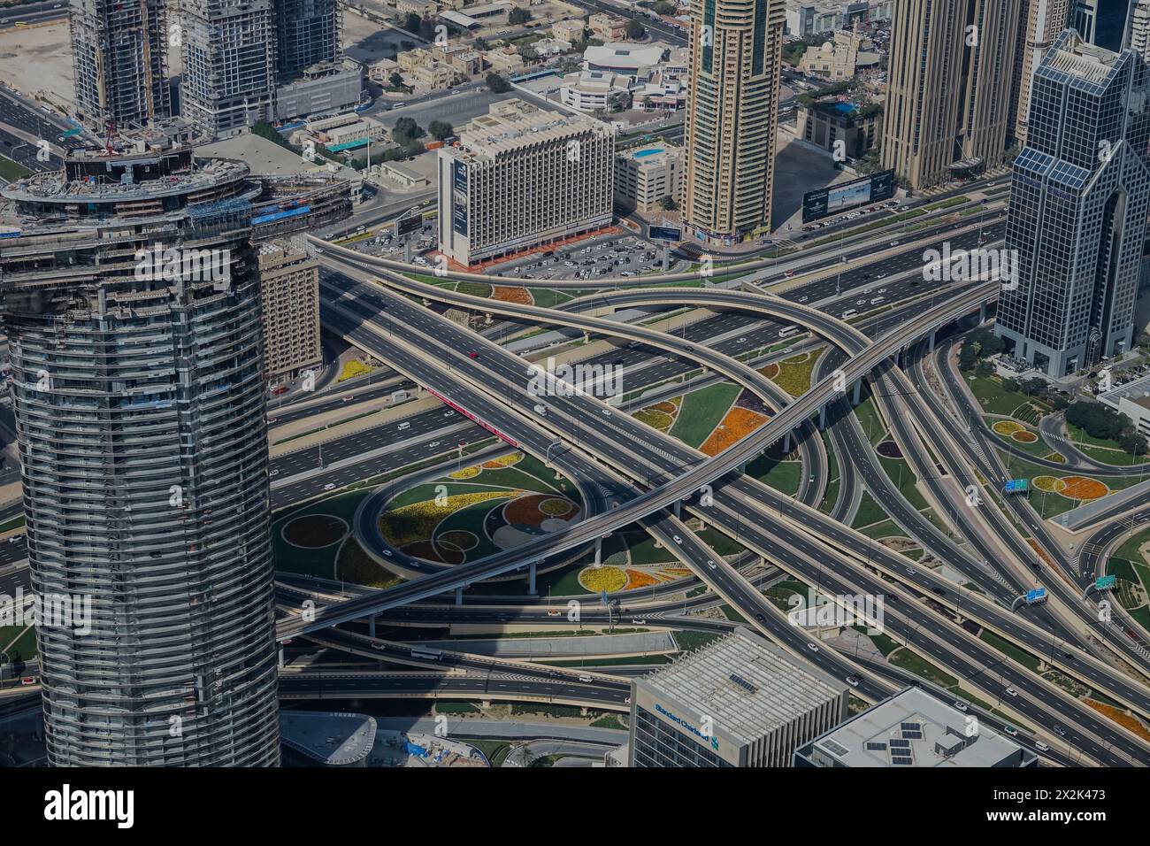 A high-angle shot capturing a complex urban highway interchange with ...