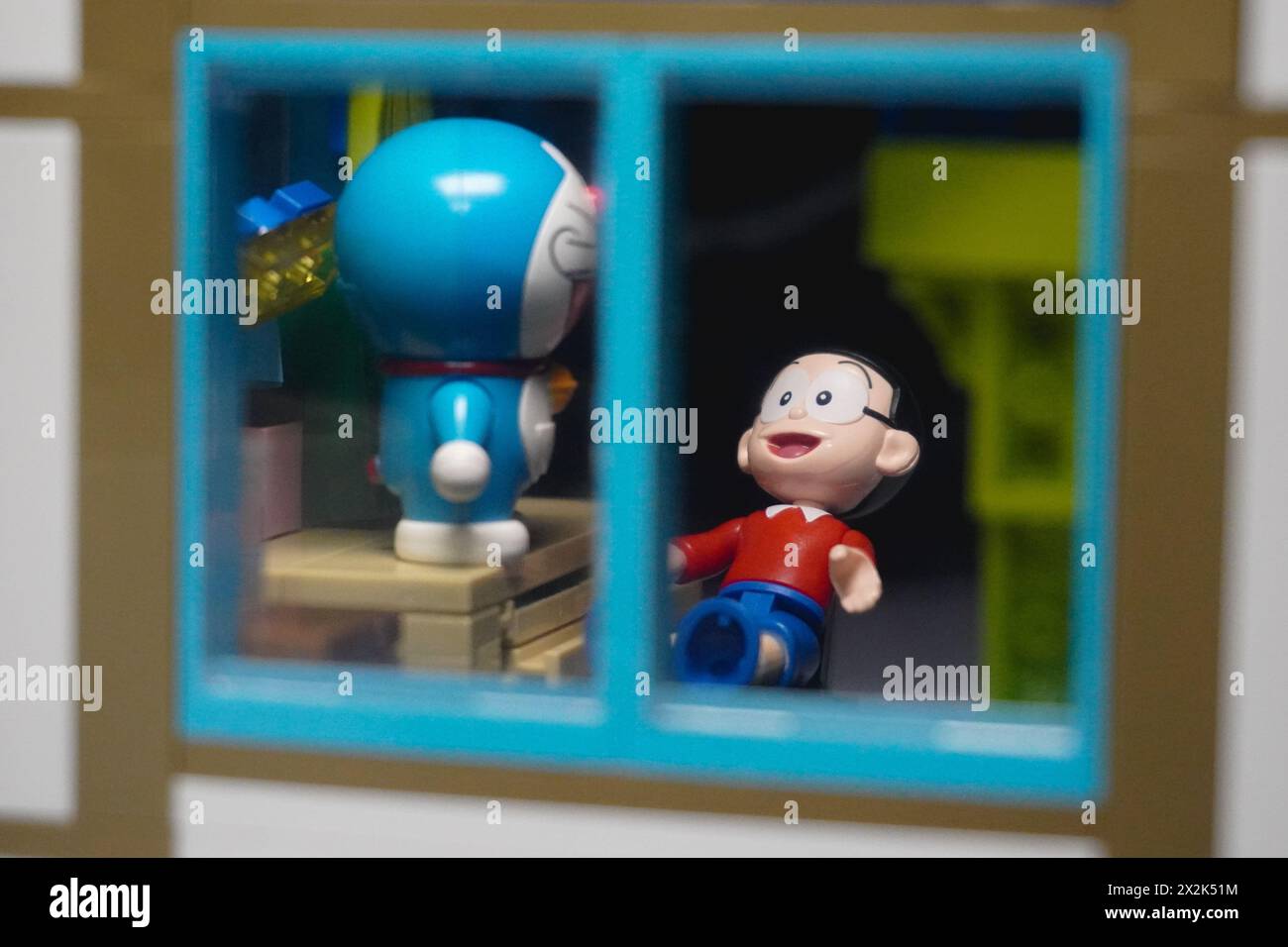Japanese toy figures (Nobita and Doraemon) staring at each other in the ...