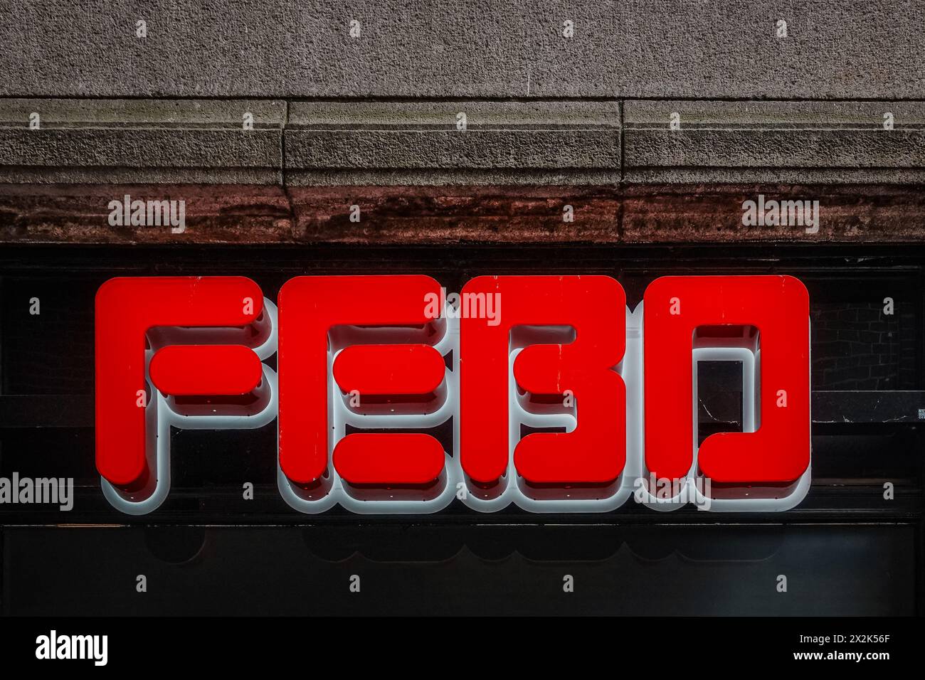 A close-up view of the luminous red and white FEBO sign mounted on a ...