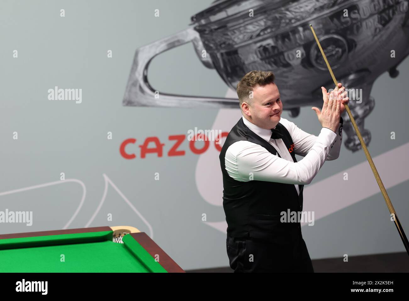 Sheffield, Britain. 22nd Apr, 2024. Shaun Murphy of England greets the ...