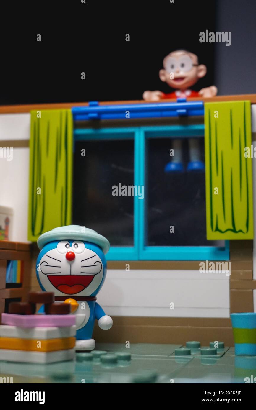 The figure of Nobita peeking at Doraemon from outside the window Stock ...