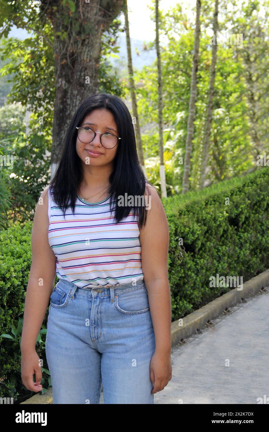 Teenage woman shows an attitude of annoyance and anger with a very ...