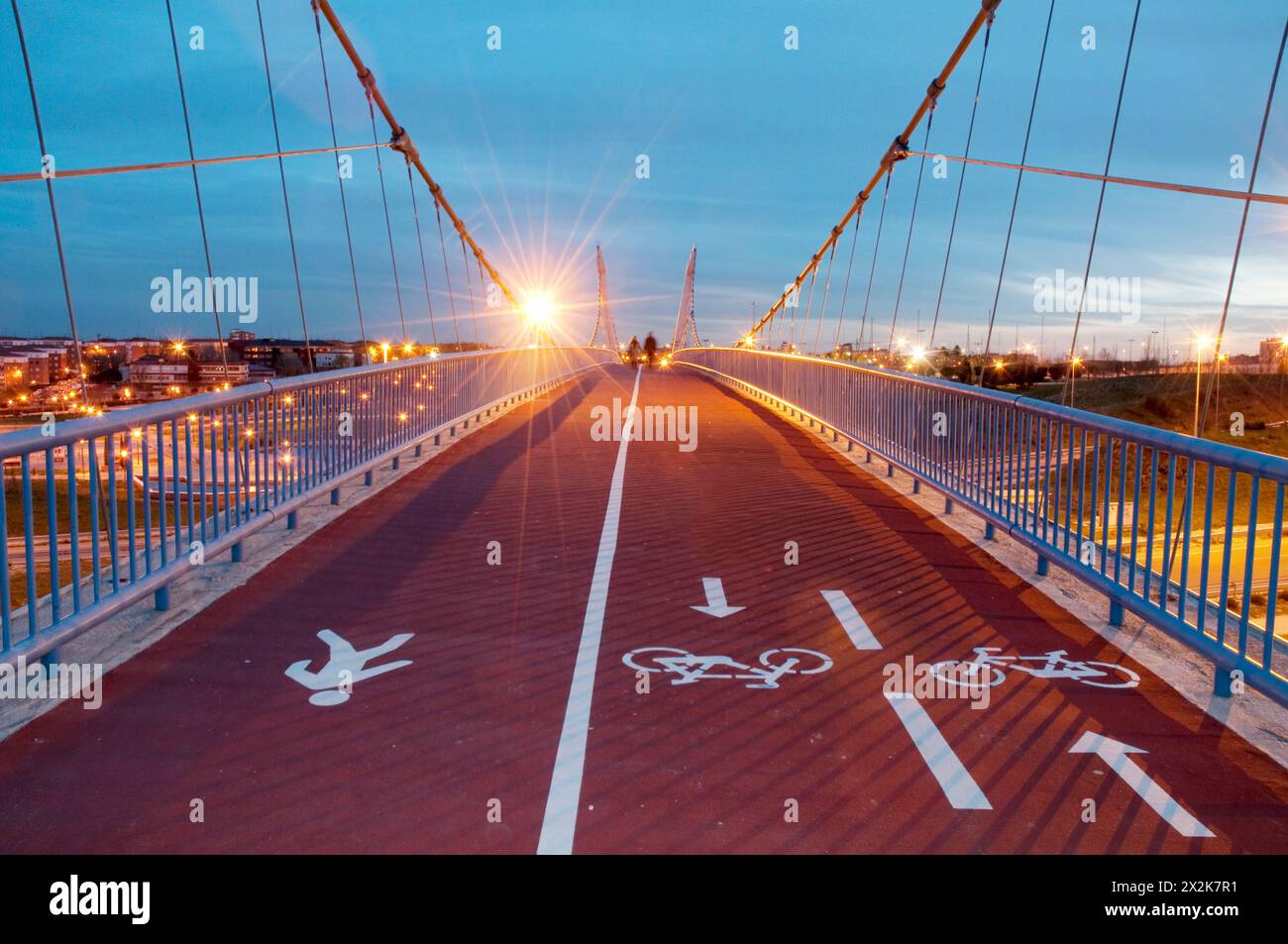 Cycle lane and footbridge over Radial 3 motorway, night view. Madrid ...