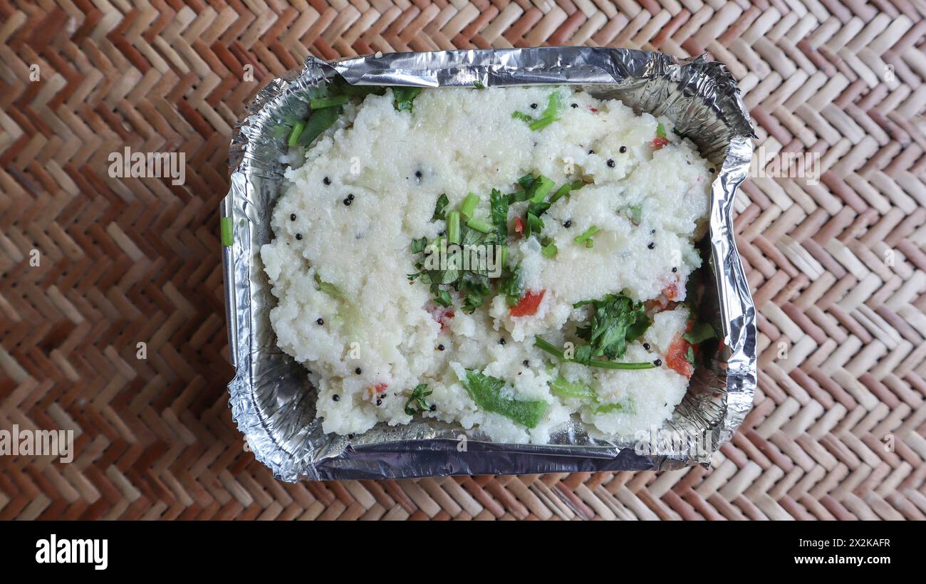 Delicious Upma breakfast food parcel in disposable container take away ...