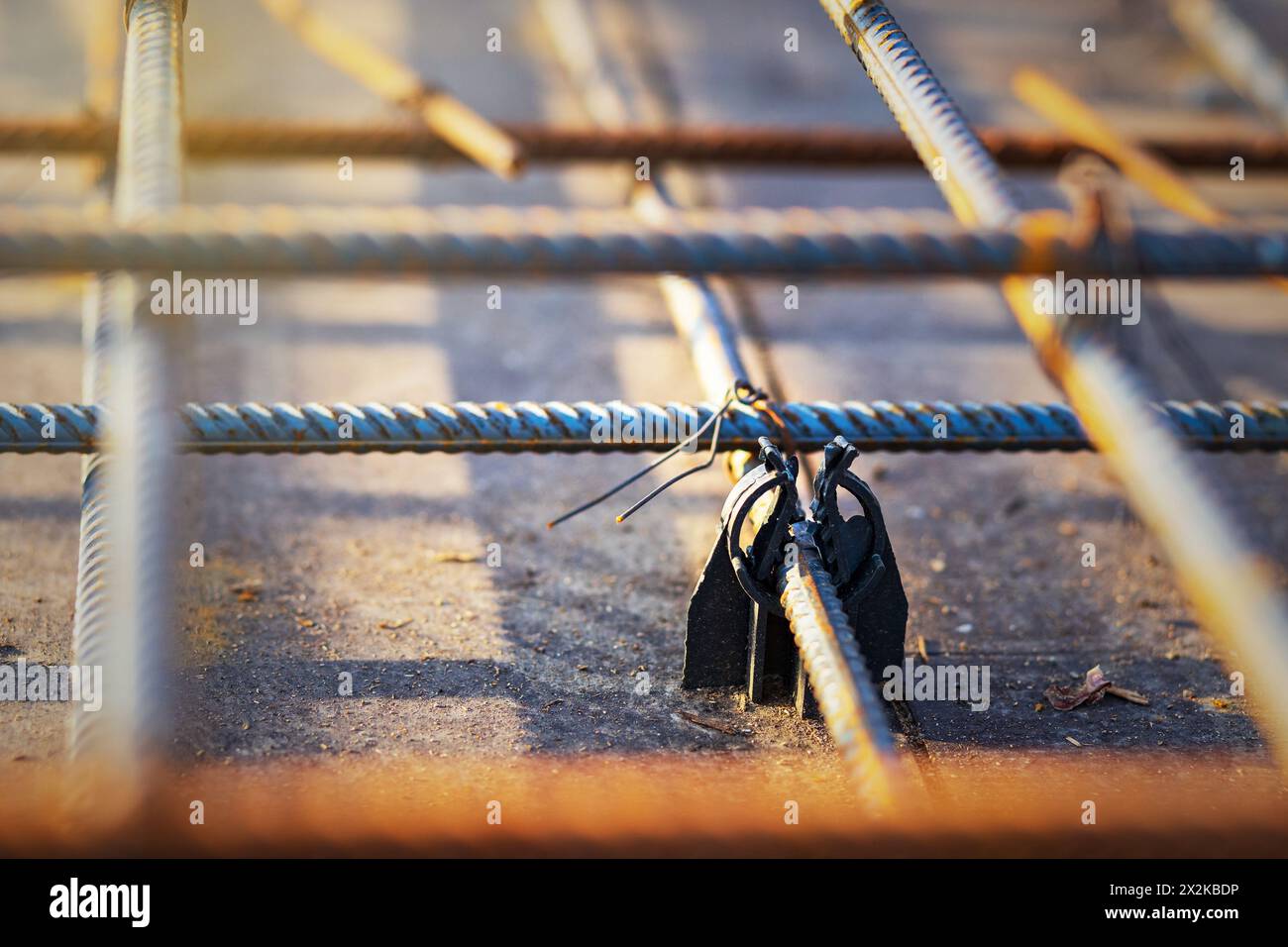 Black plastic reinforcing bar holders are used as formwork components ...