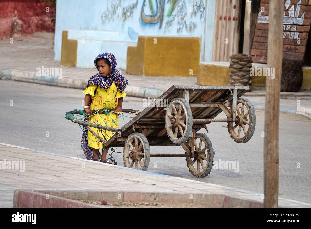 Hormuz, Iran - January 4, 2023: Unknown Iran. A young girl with a cargo ...