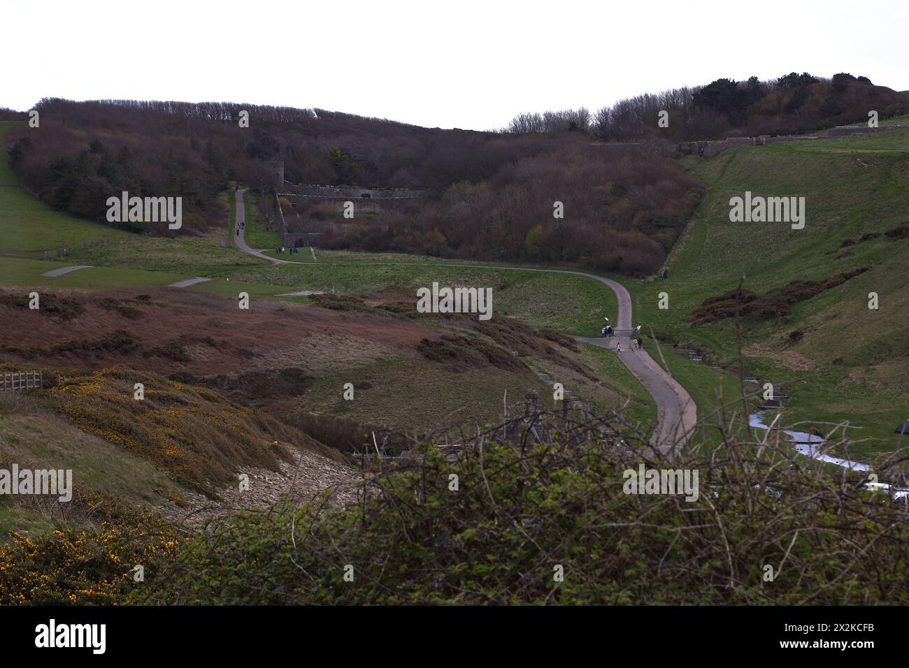 A long distance view of the Dunraven castle ruins and associated walled ...