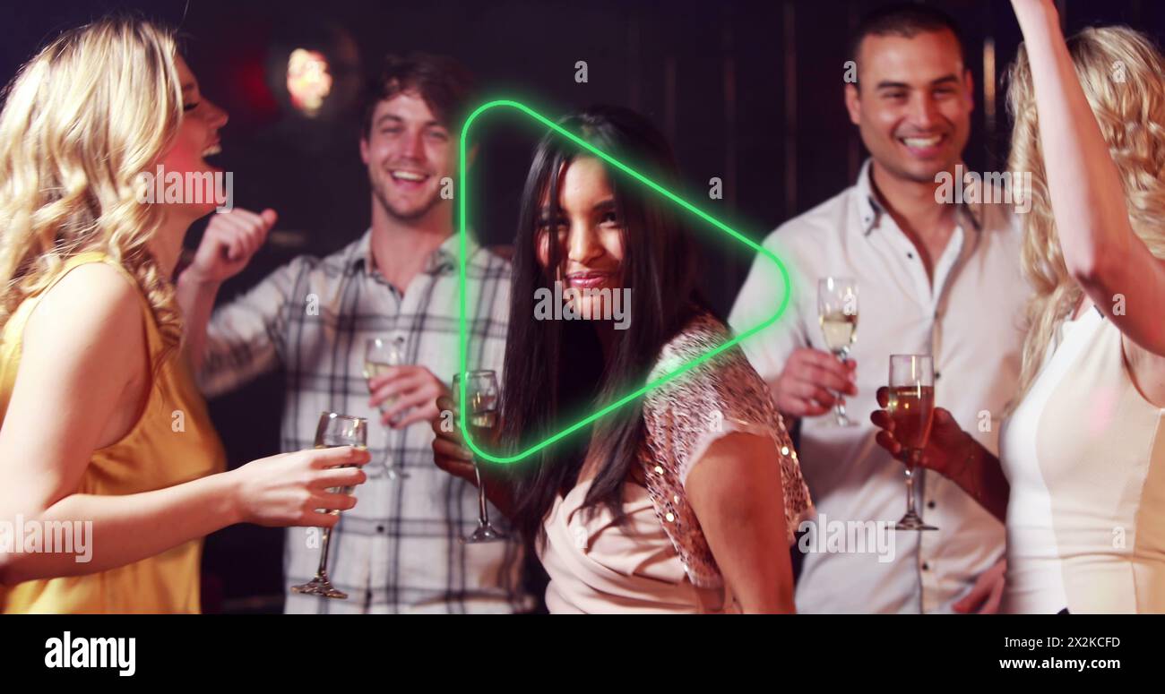 Image of play over happy diverse female and male friends drinking wine ...