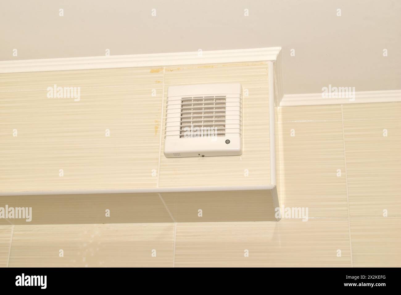 Ventilation system, a box lined with tiles and a fan mounted on the box ...