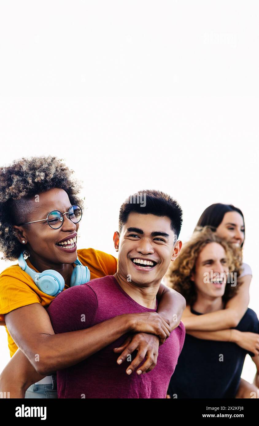 Diverse group of young people having fun together outdoors Stock Photo ...