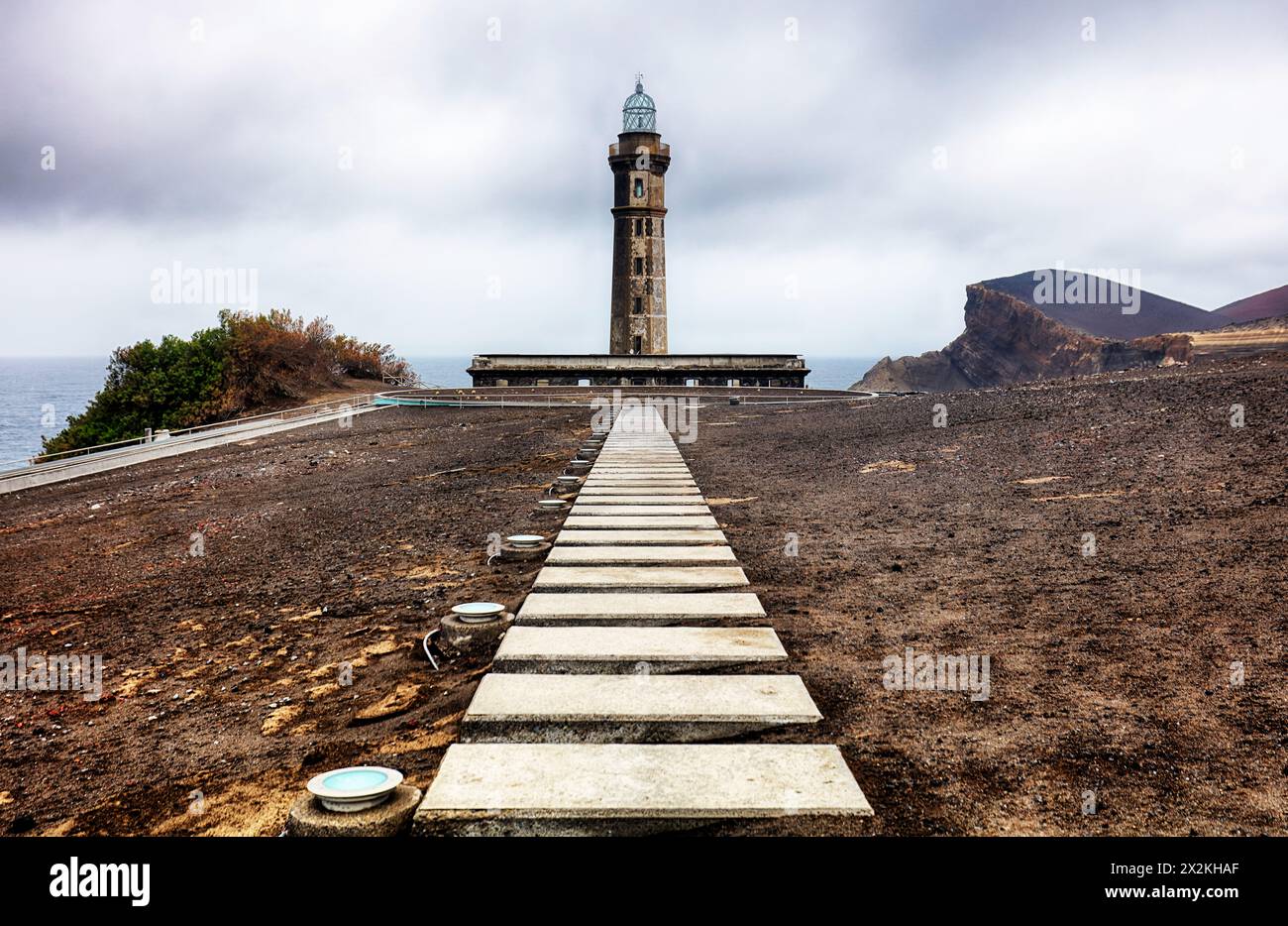 Azores, Island of Faial. The lighthouse Farol dos Capelinhos at Ponta ...