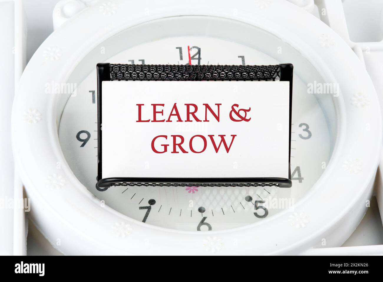 Learn and Grow written on a white business card Stock Photo - Alamy