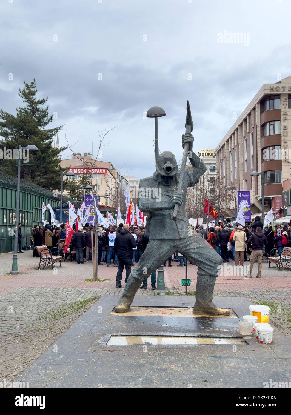 Ankara, Turkey - March 25, 2024: The statue of a miner and protesters ...
