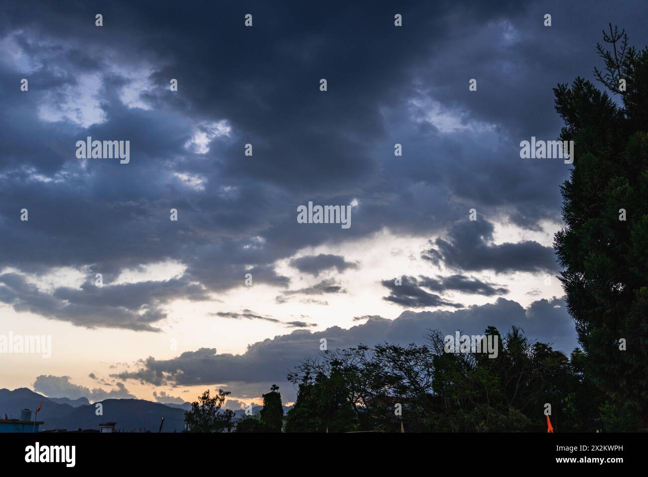 Dawn shot in Dehradun City with Mussoorie hills and majestic cloudscape ...