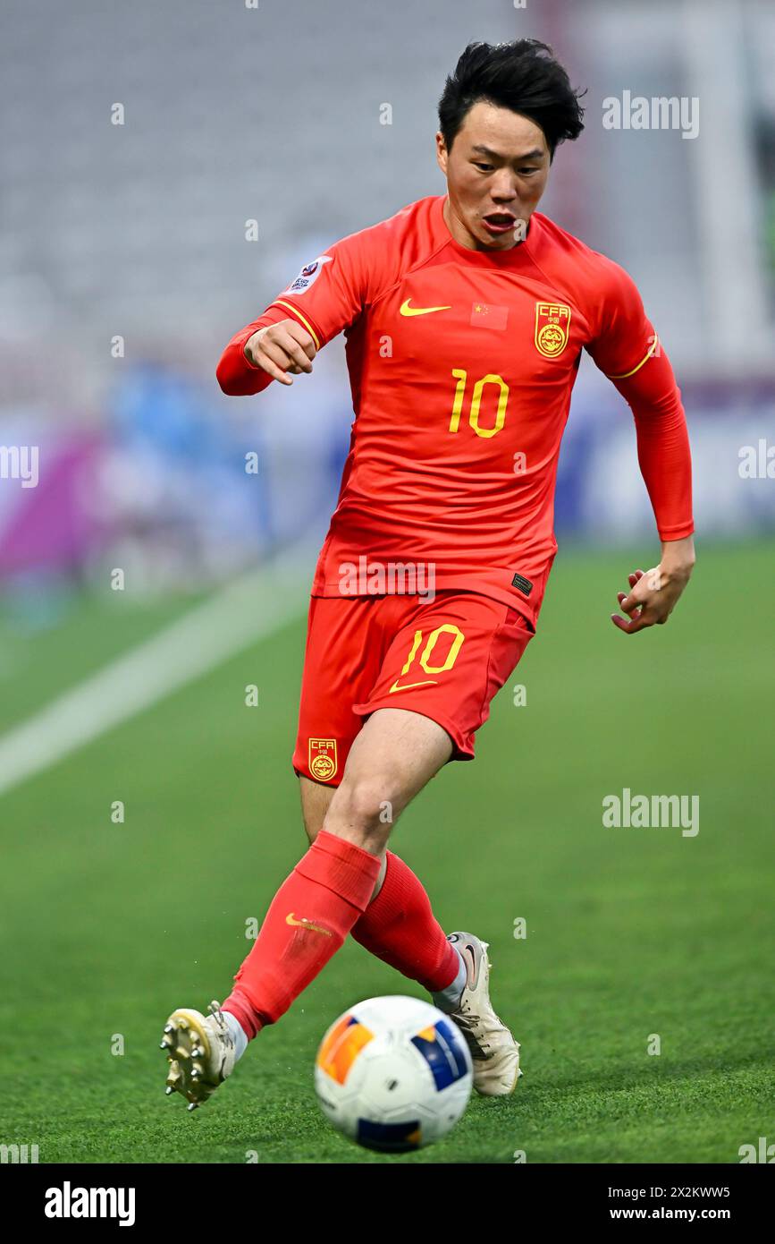 Doha, Qatar. 22nd Apr, 2024. Jia Feifan of China control the ball ...