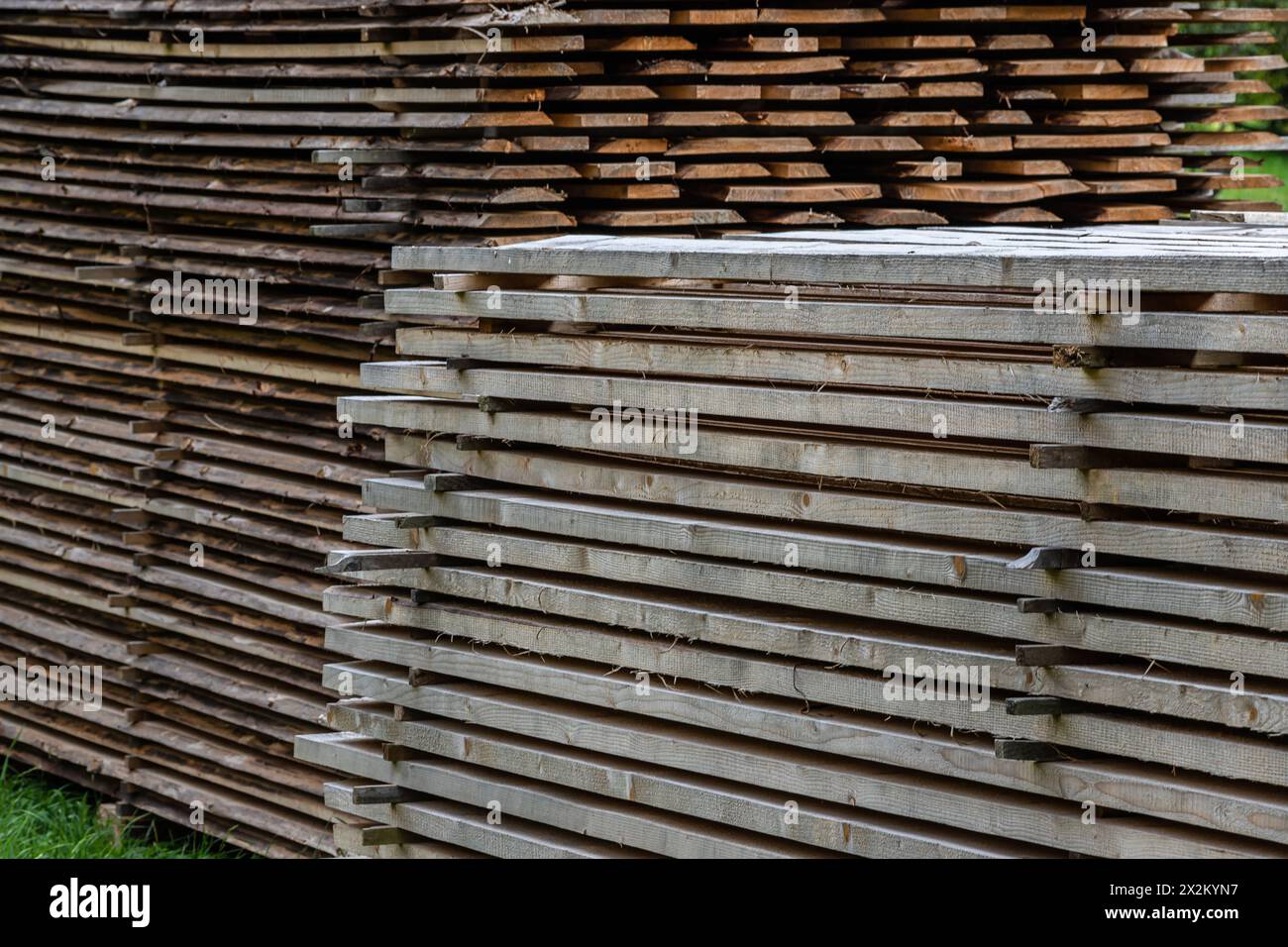 Piles of wooden boards in the sawmill, planking. Warehouse for sawing ...