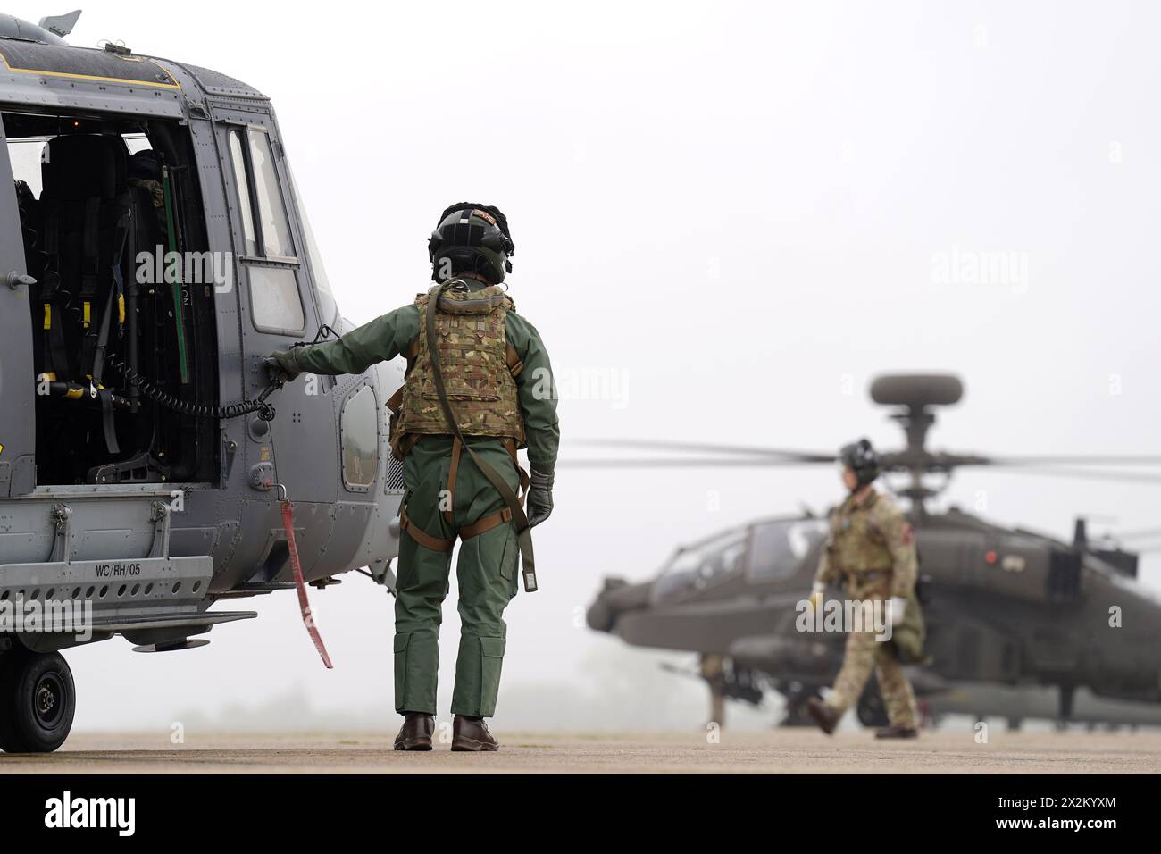A Wildcat reconnaissance helicopter (left) and a British Army Apache AH ...