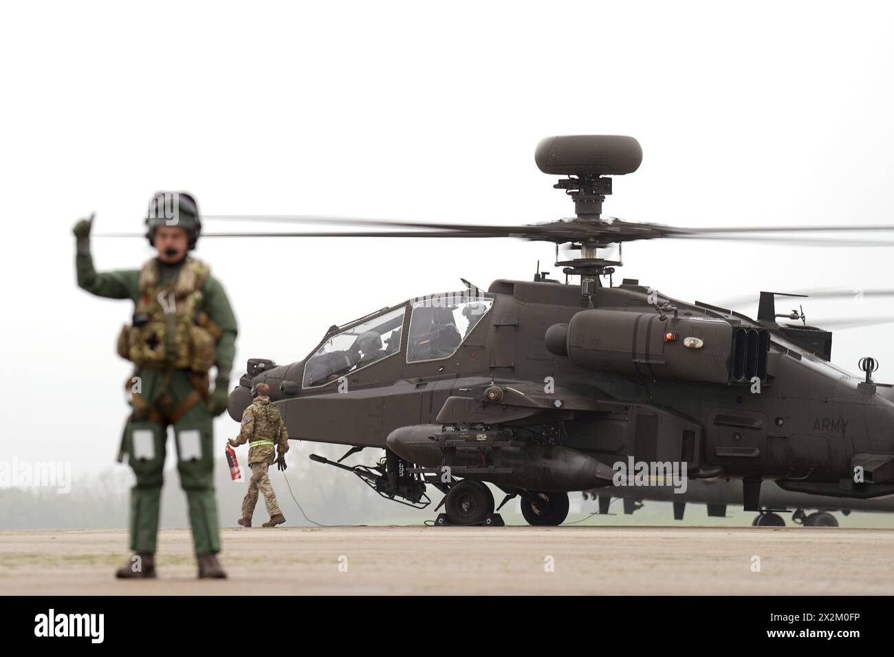 British Army Apache AH-64E attack helicopters are prepared for take off ...