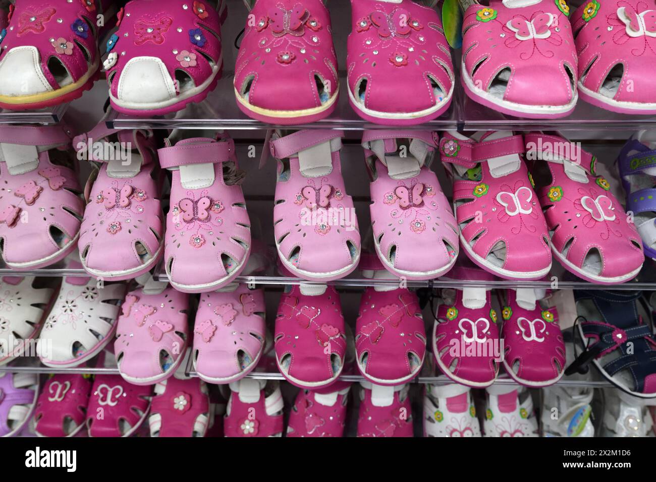 Children's Shoes on store counter Stock Photo - Alamy
