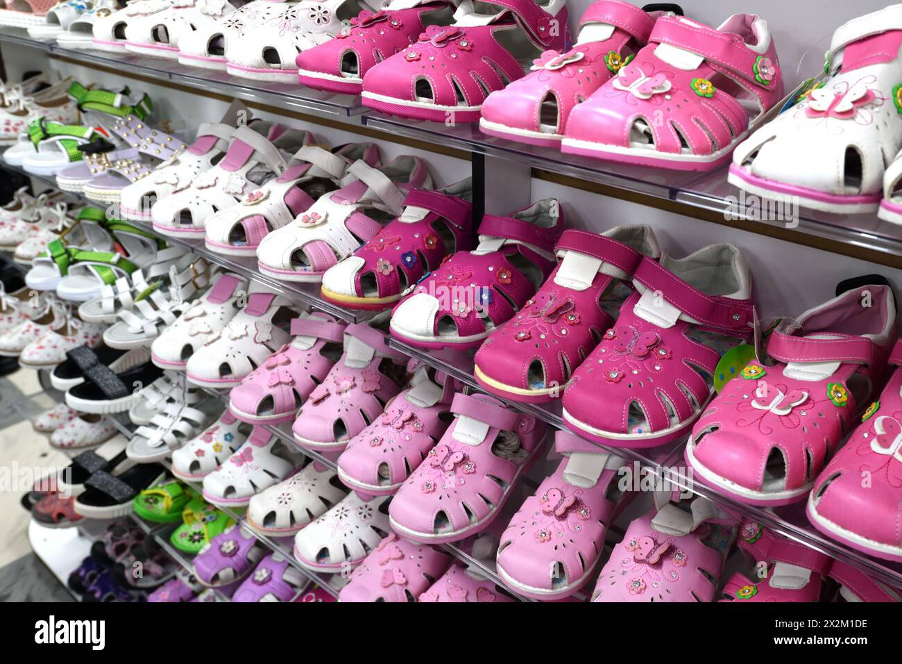 Children's Shoes on store counter Stock Photo - Alamy