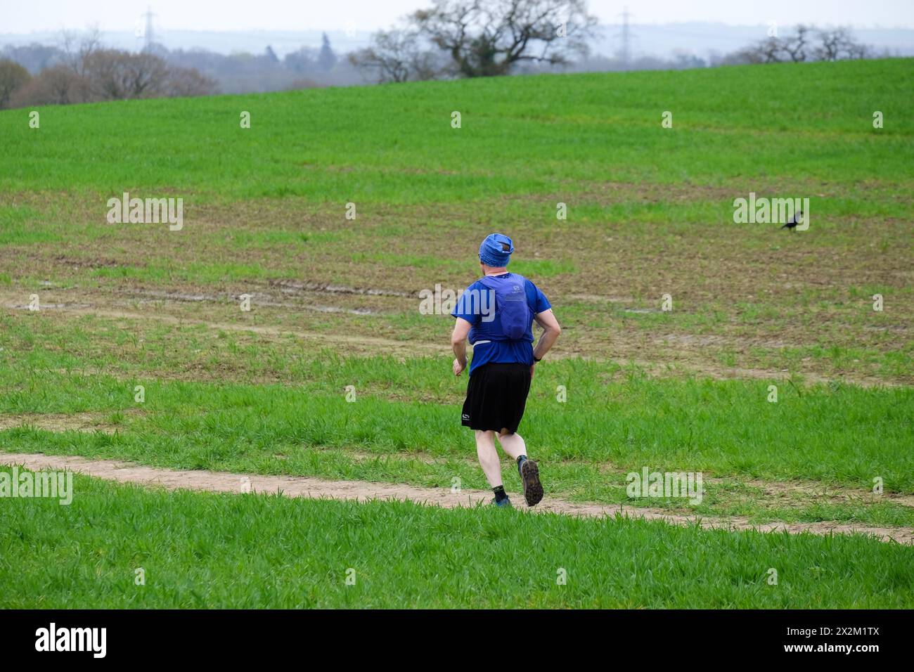 Person running across field hi-res stock photography and images - Alamy