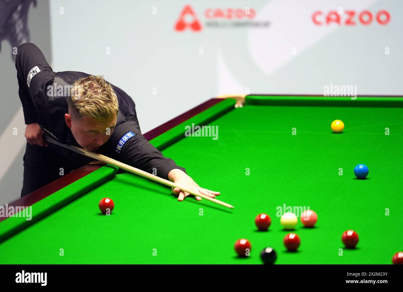 Kyren Wilson in action against Dominic Dale (not pictured) on day four ...