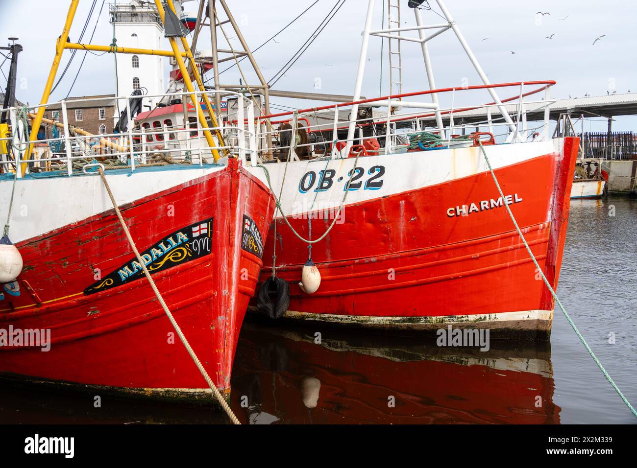 Two red fishing boats moored at the Fish Quay in North Shields, North ...