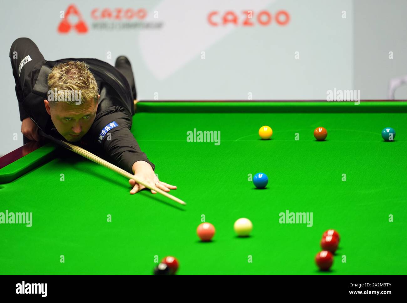 Kyren Wilson in action against Dominic Dale (not pictured) on day four ...