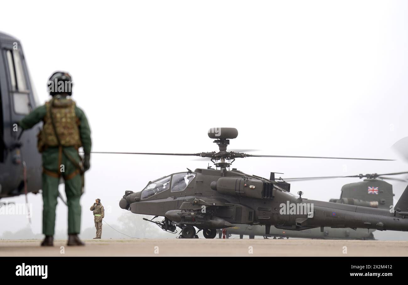 British Army Apache AH-64E attack helicopters are prepared for take off ...