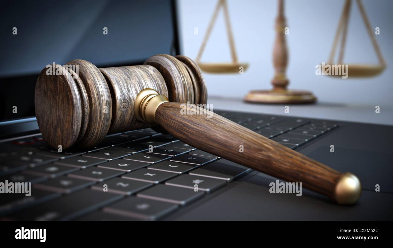 Judge gavel and balanced scale standing on laptop computer keyboard. 3D ...