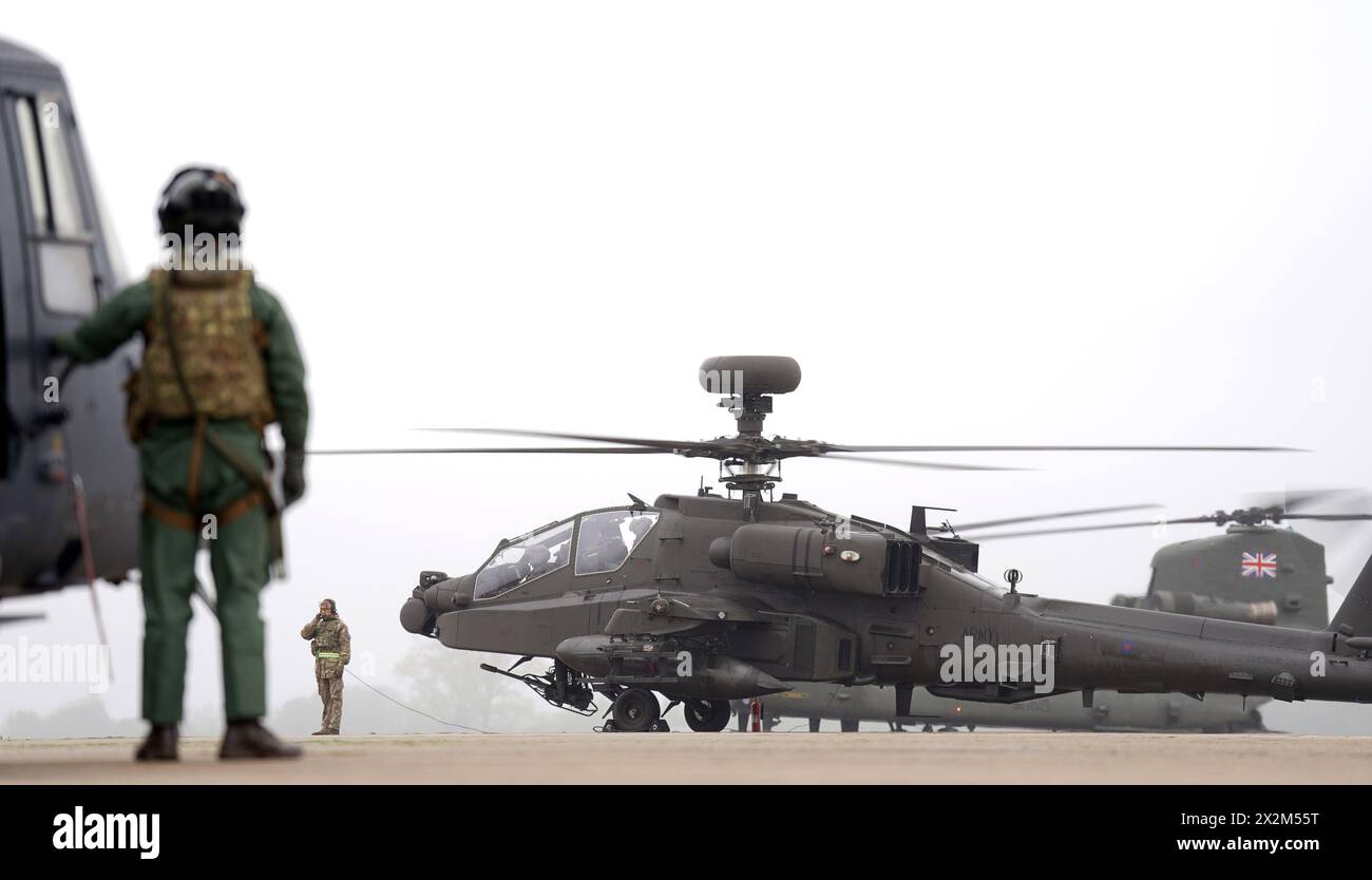British Army Apache AH-64E attack helicopters are prepared for take off ...