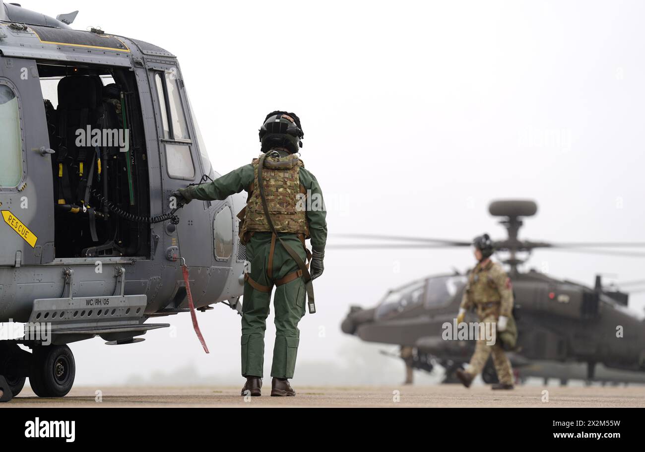 British Army Apache AH-64E attack helicopters are prepared for take off ...
