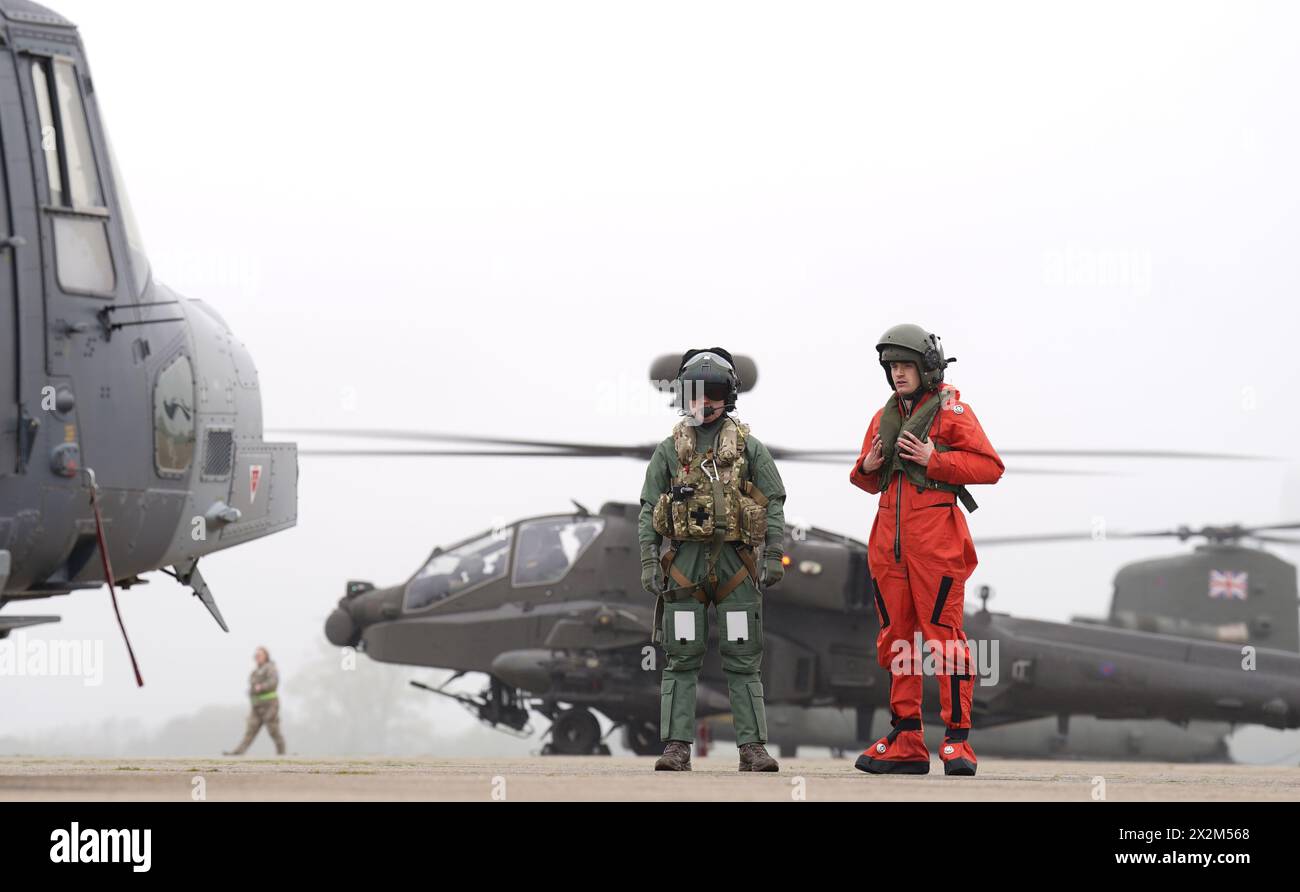 British Army Apache AH-64E attack helicopters are prepared for take off ...
