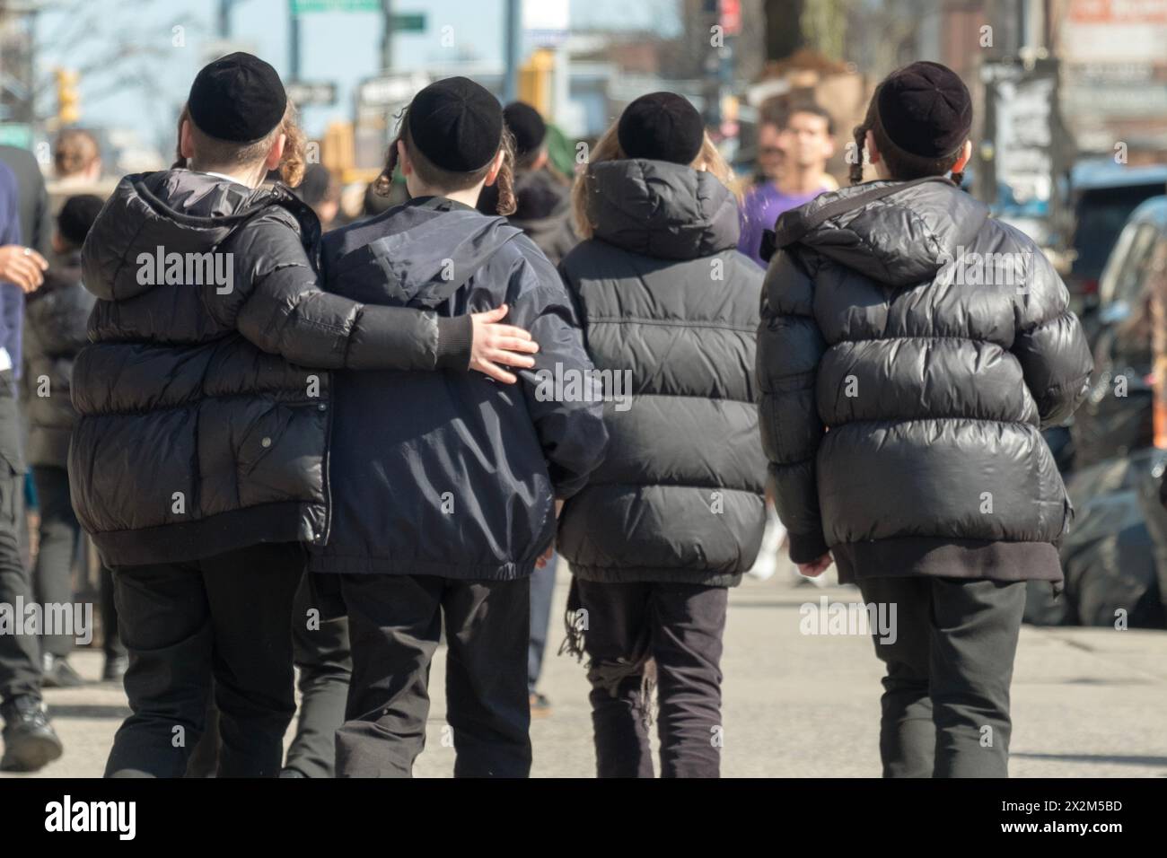 FRIENDSHIP. 4 orthodox Jewish boys wearing black yarmulkes walk ...