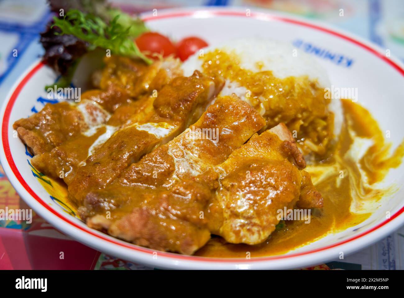 A delicious curry fried chicken chop rice in a Hong Kong tea restaurant ...