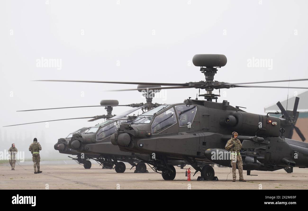 British Army Apache AH-64E attack helicopters are prepared for take off ...