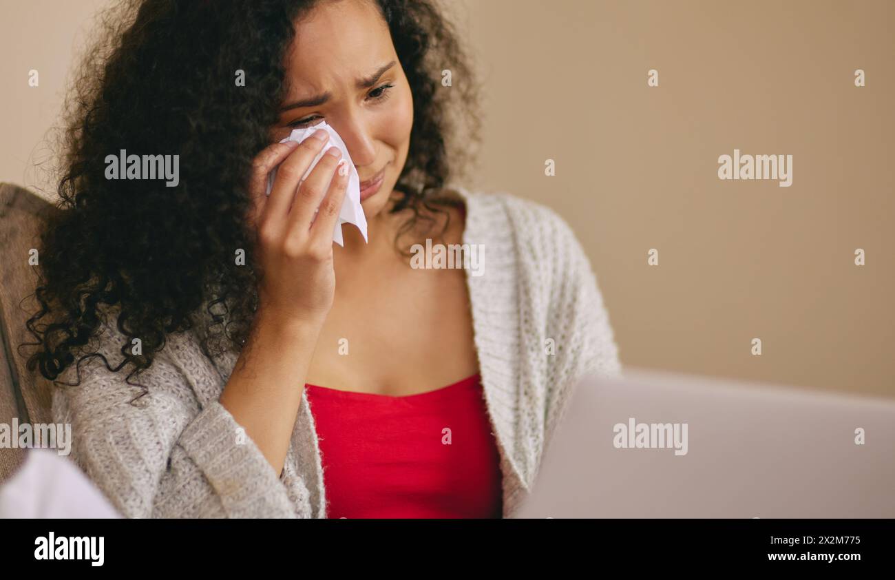 Sad girl crying browsing internet hi-res stock photography and images ...