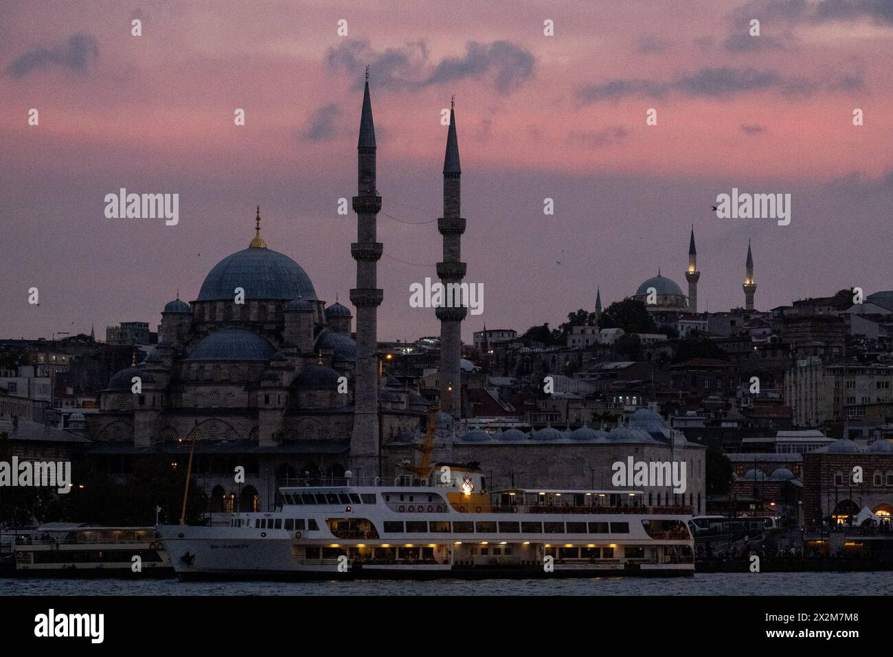 The cityscape at dusk of the Golden Horn estuary with the New Mosque ...