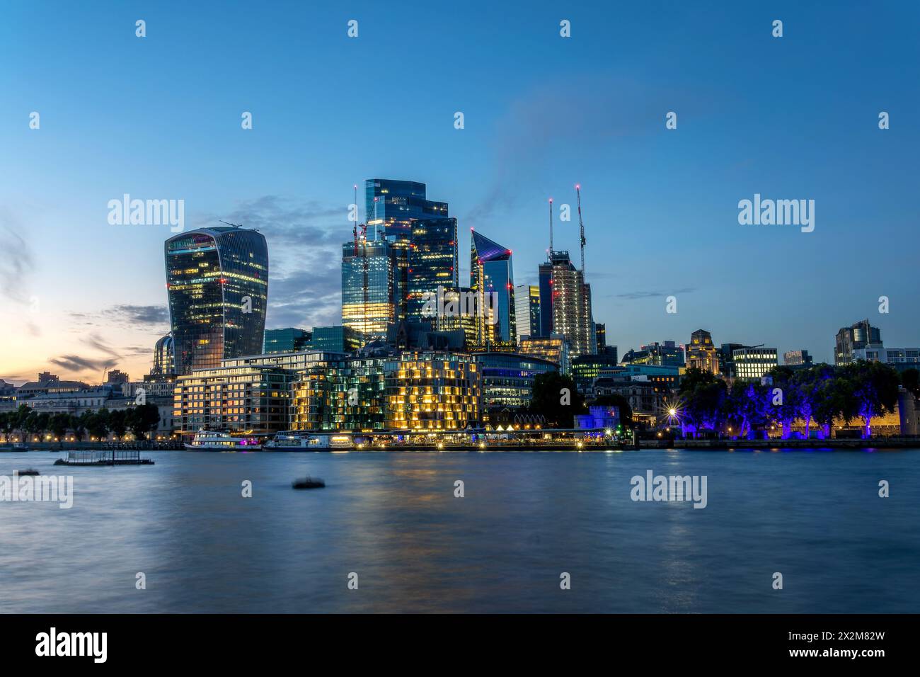 The City of London and the river Thames at night, in London, UK Stock ...