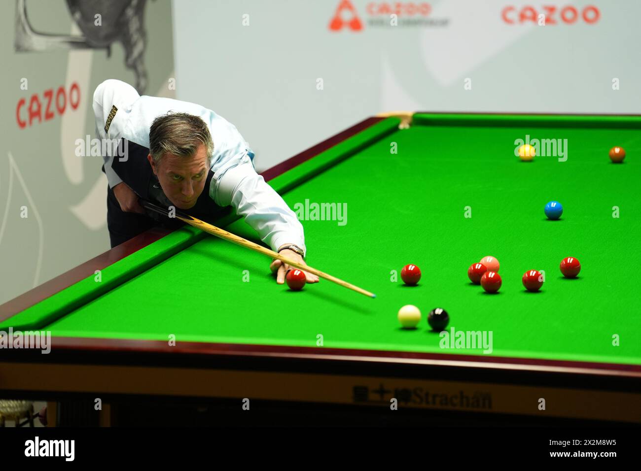 Dominic Dale in action against Kyren Wilson (not pictured) on day four ...