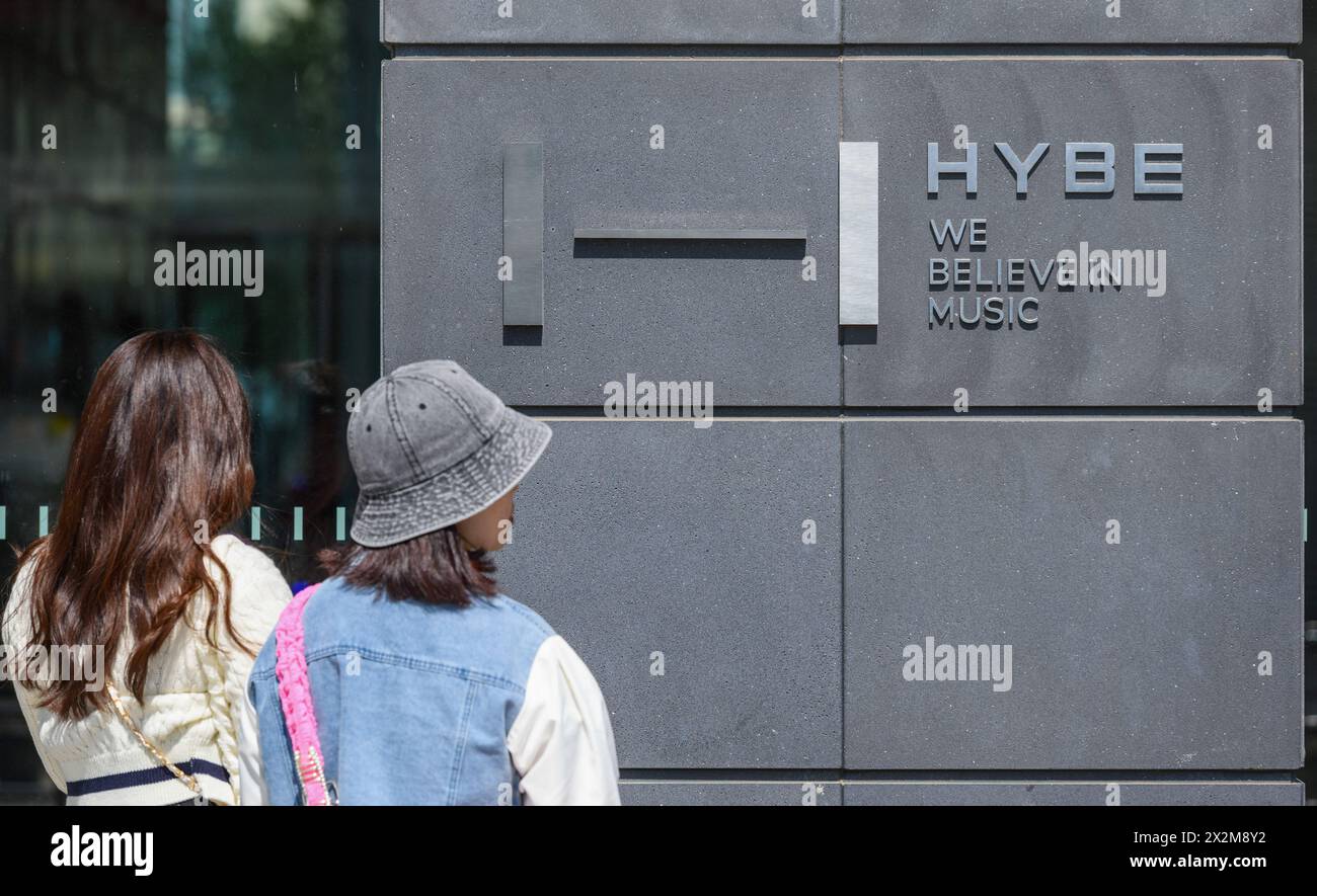 Seoul, South Korea. 23rd Apr, 2024. People walk past the Hybe Building ...