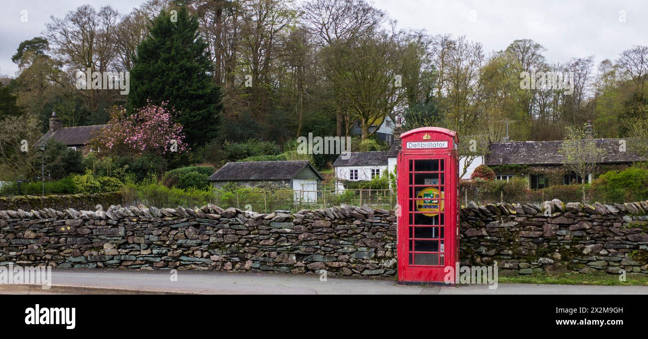 A red telephone box used to house a defibrillator in the village of ...