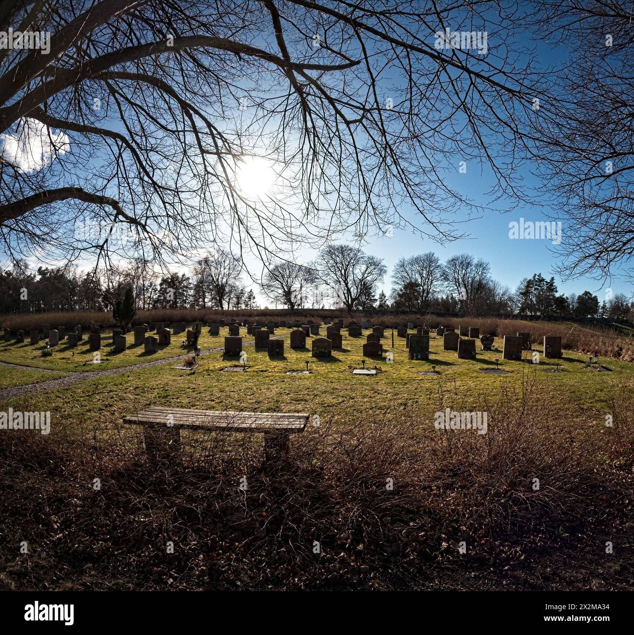 The sun is setting over unesco heritage Woodland cemetery in sweden ...