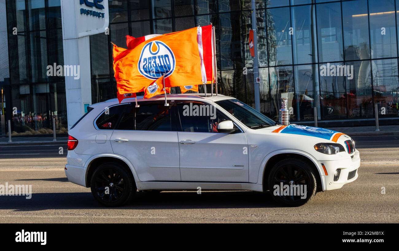 Edmonton Oilers fans in a car decorated with flags head to Game 1 of ...
