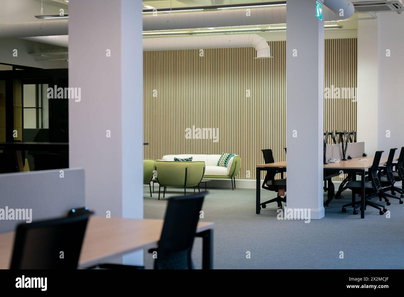 A stylish modern office space featuring a mix of collaborative areas ...