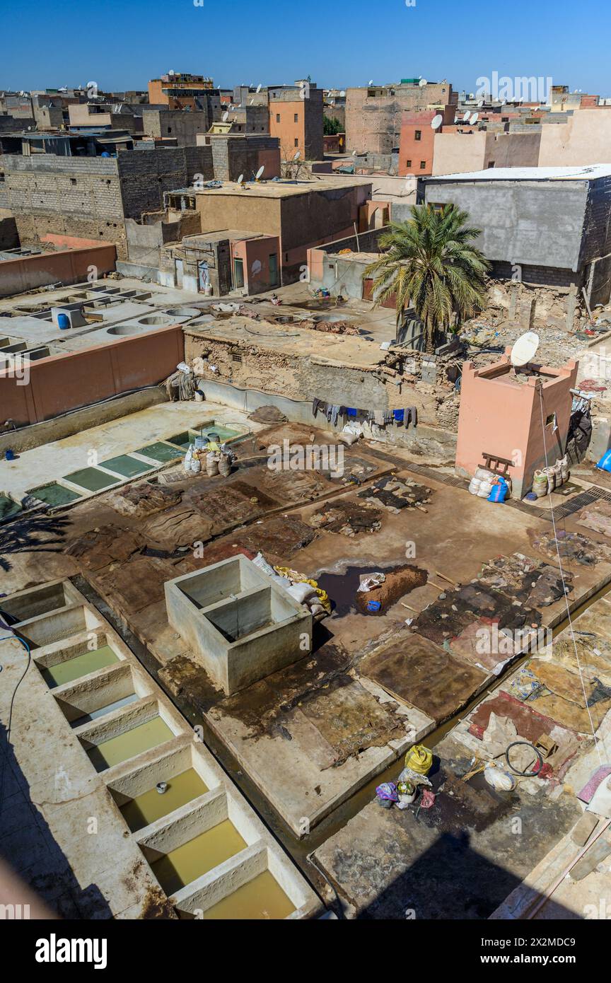 Aerial view of historic Moroccan tannery with workers dyeing leather ...