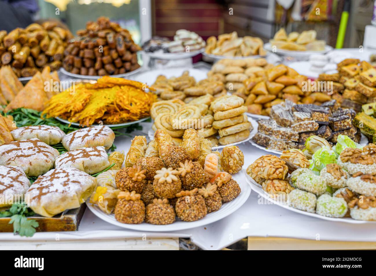 A vibrant display of various Moroccan sweets and pastries, featuring ...