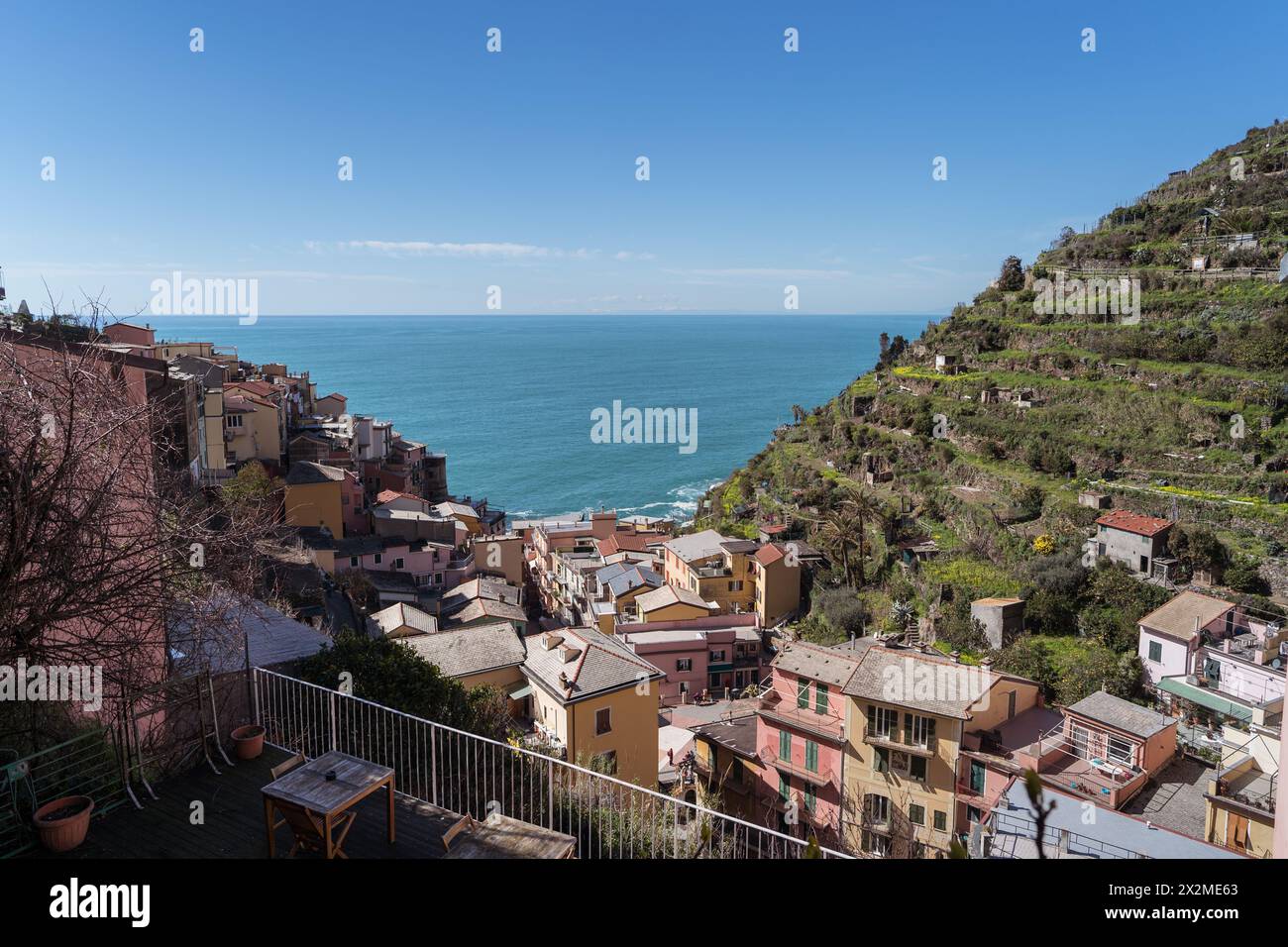 A picturesque Italian Riviera village cascades down to the serene ...