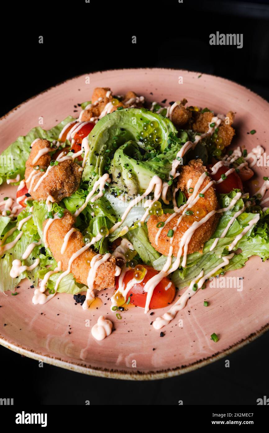 Exquisite house salad with a mezclum base, cherry tomatoes, avocado ...