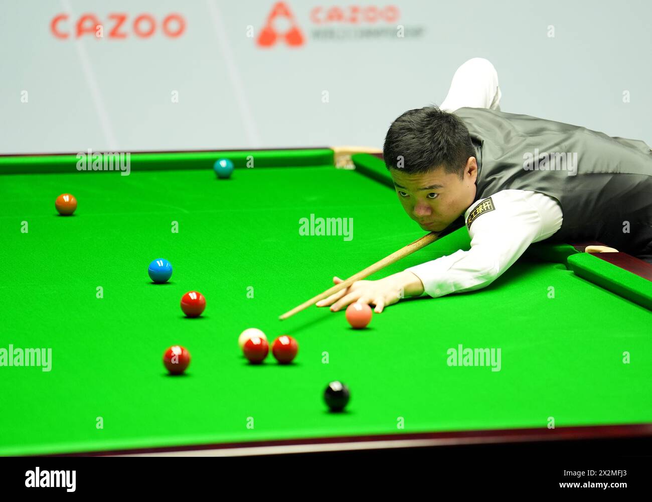 Ding Junhui in action against Jack Lisowski (not pictured) on day four ...